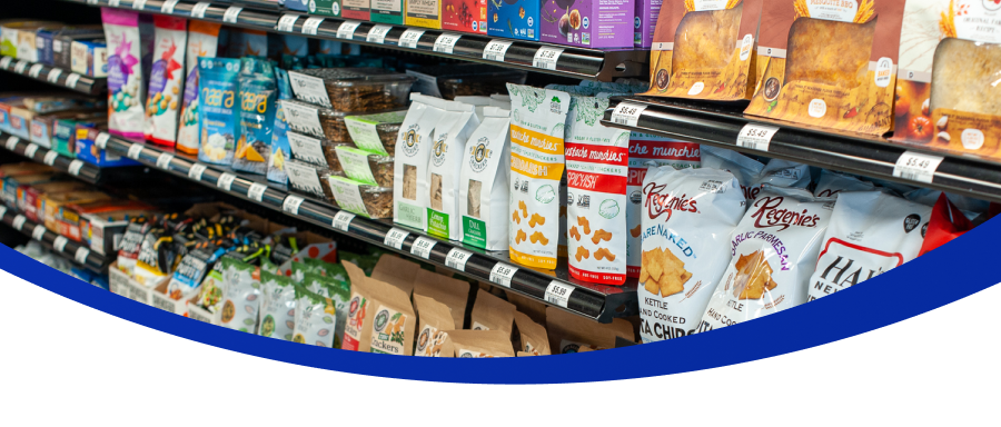 A grocery store shelf filled with products source from Mable.